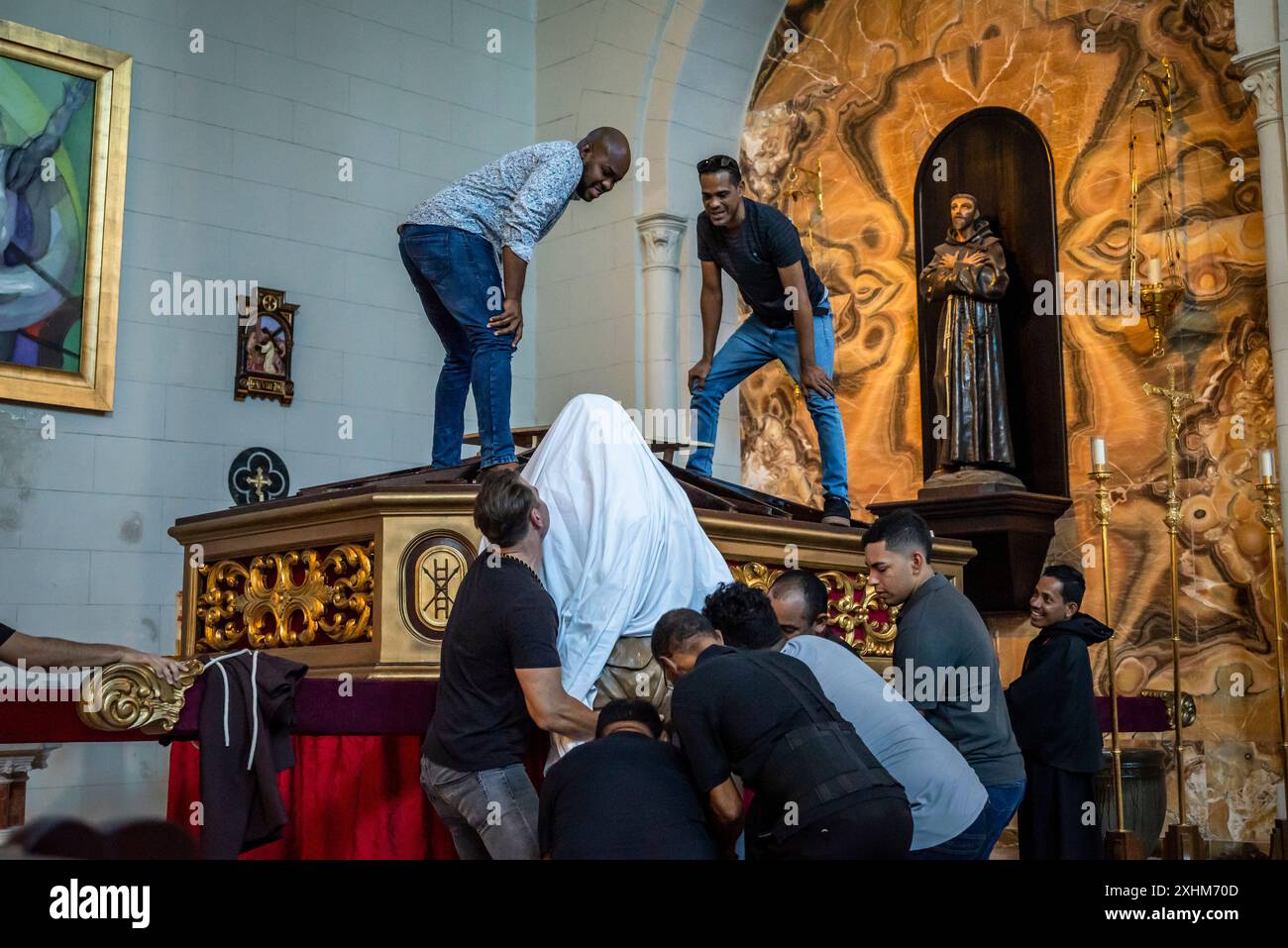 People preparing statue of Virgin Mary for the Lent procession, Church ...