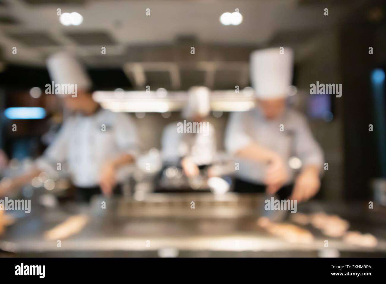 Chef cooking in restaurant kitchen blurred defocused background Stock ...