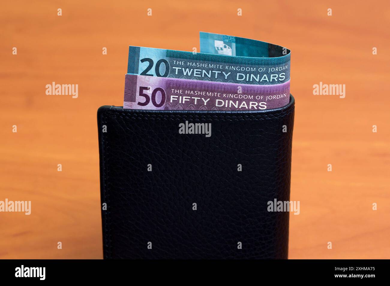 Jordanian money - dinar in the black wallet Stock Photo - Alamy