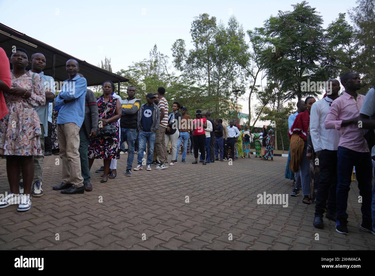 People line up to cast their vote in a presidential election in Kigali ...