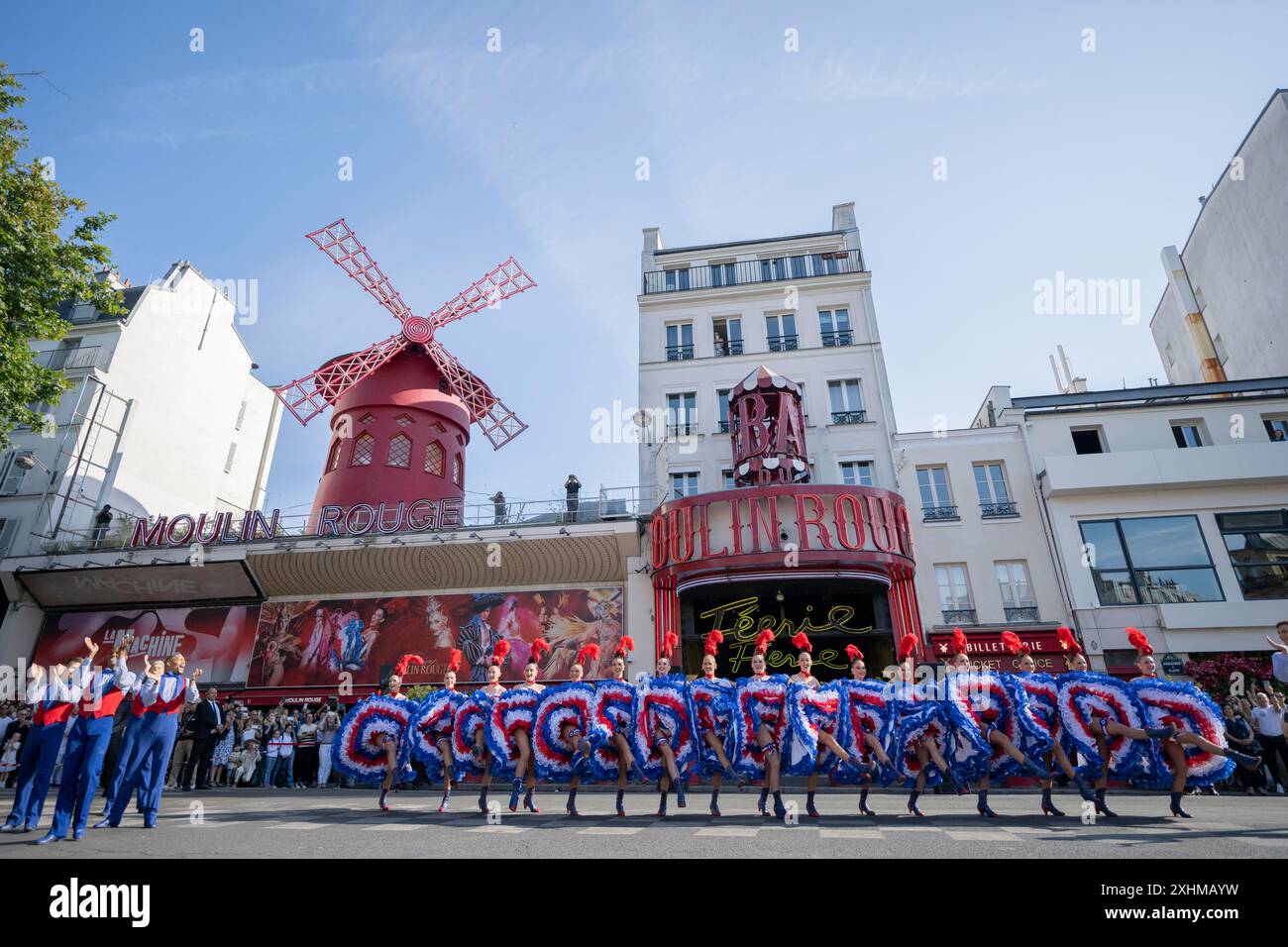 Paris, France. 15th July, 2024. Dancers from the Moulin Rouge cabaret ...