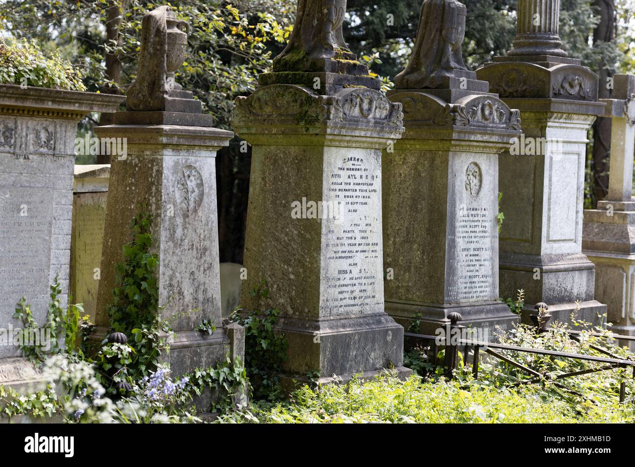 A row of old, carved, stone grave monuments in Highgate Cemetery, London, UK Stock Photo - Alamy