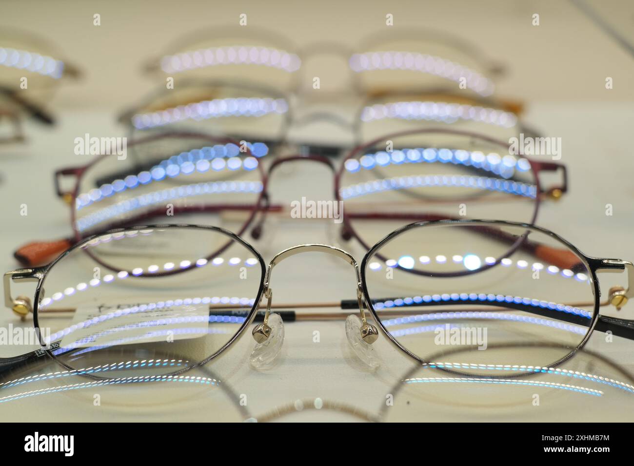 Glasses on display in a shop window Stock Photo - Alamy