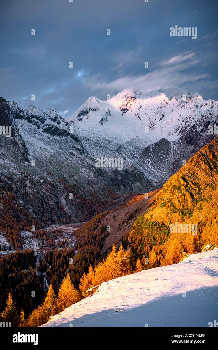 Snowy Monte Disgrazia at sunset in autumn, aerial view, Italian Alps ...