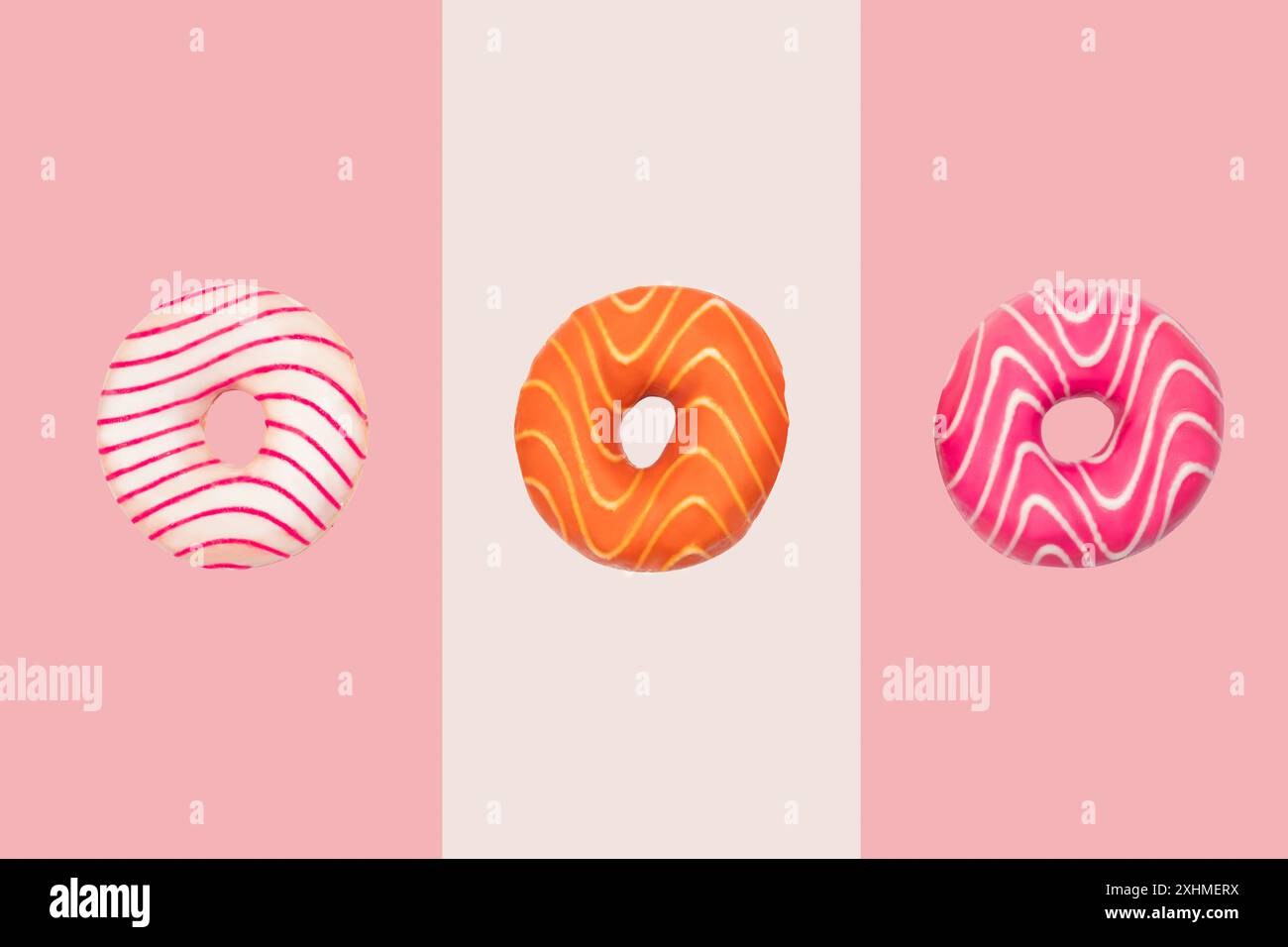 Three donuts with colorful glaze Stock Photo - Alamy