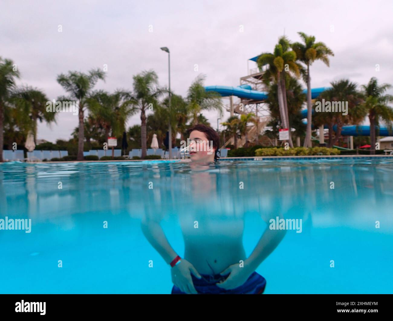 Teen Boy in Florida Pool Head Above the Water Stock Photo - Alamy