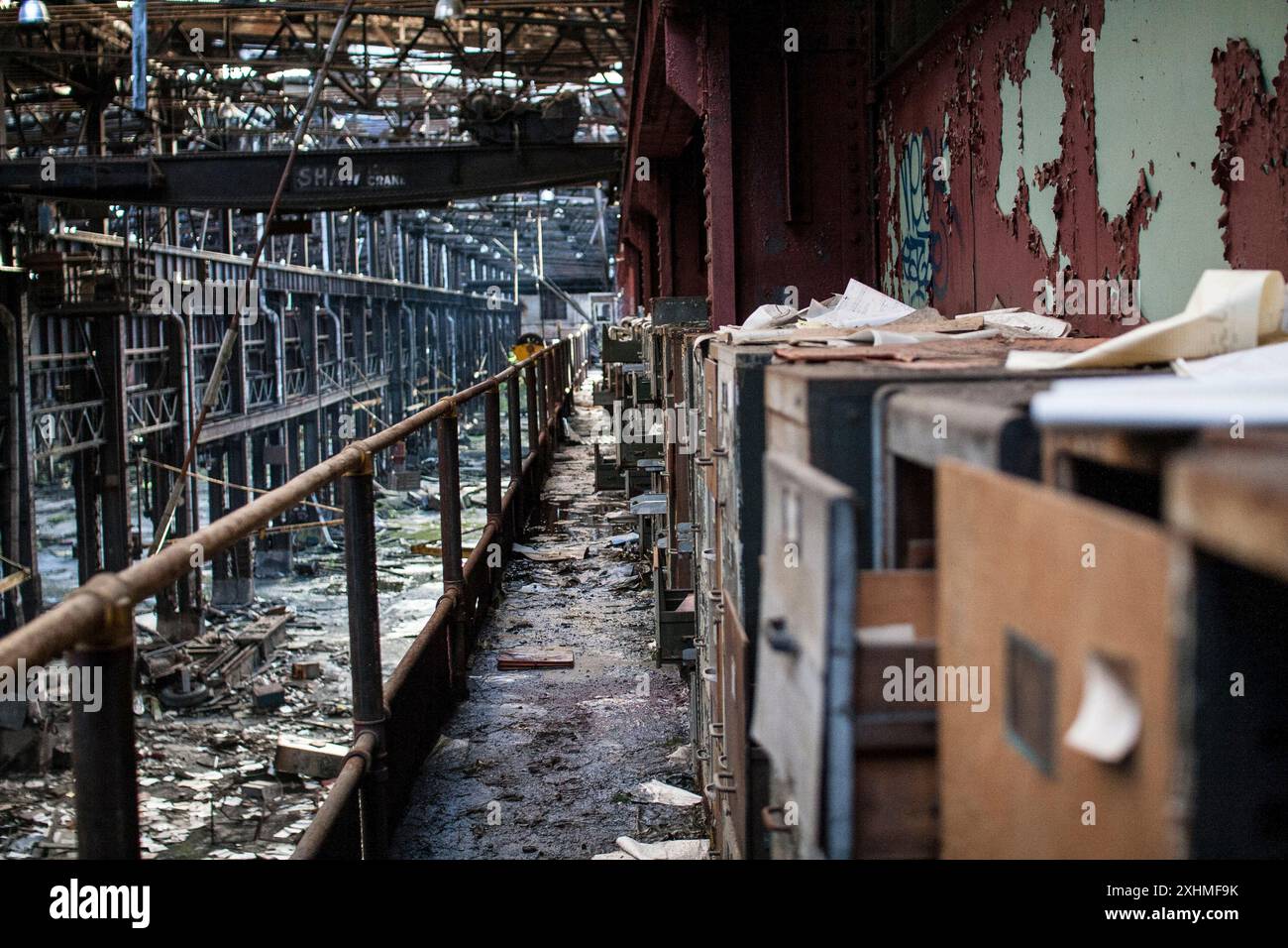 Abandoned industrial warehouse with rusted equipment & debris Stock ...