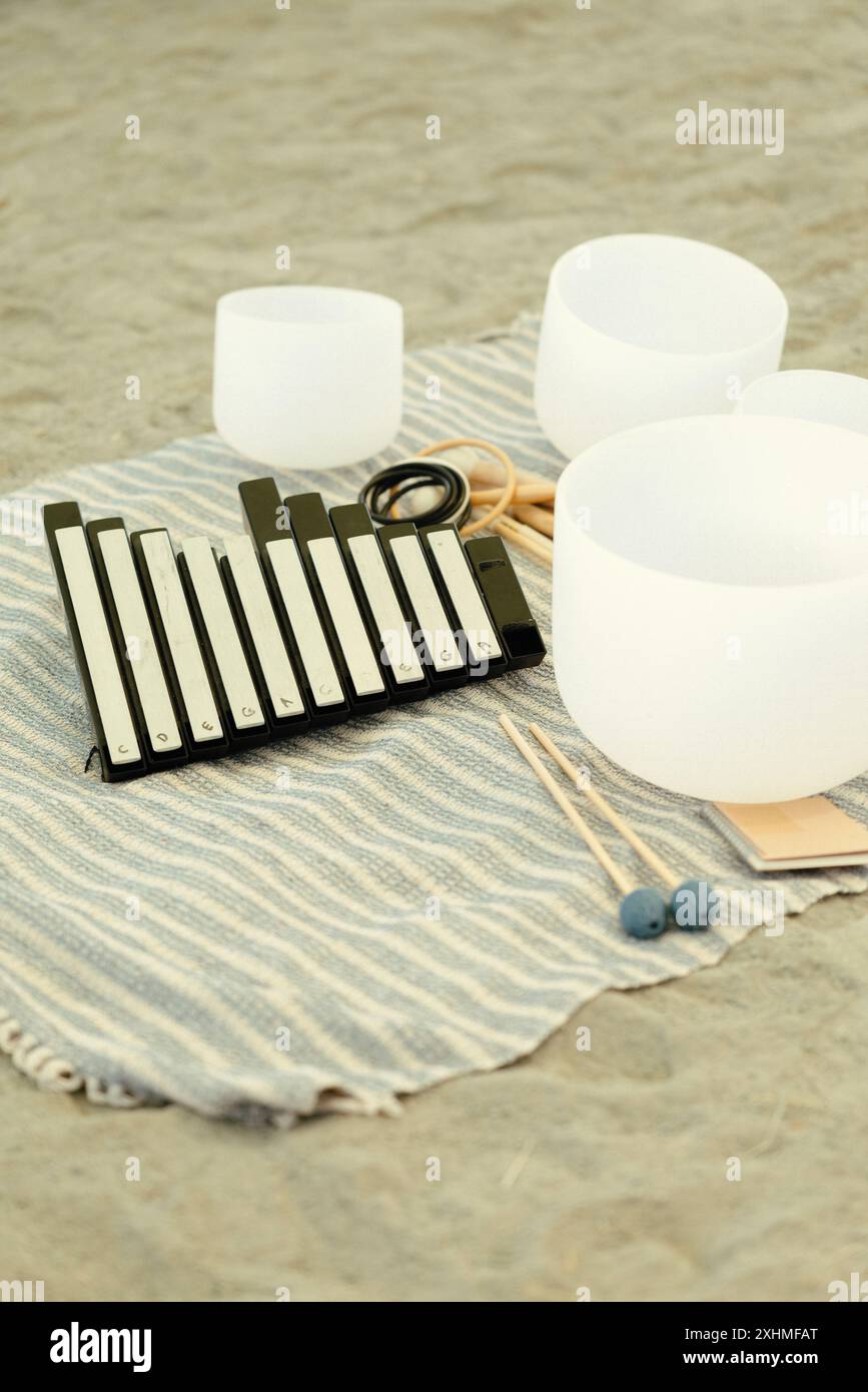 Sound bath instruments on a striped cloth mat Stock Photo - Alamy