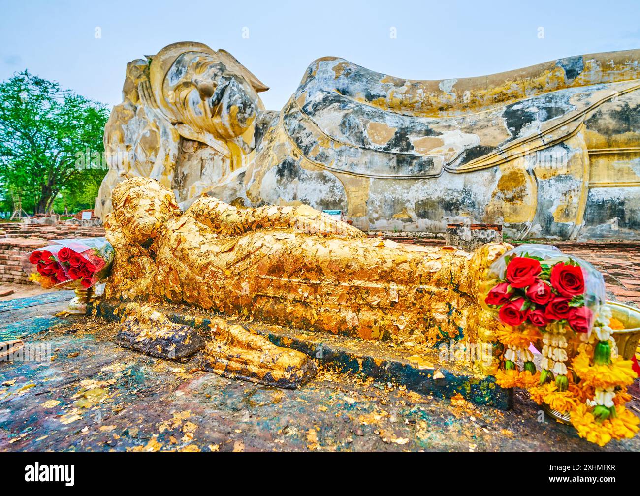 The small altar with the smalled Buddha sculpture, covered with golden ...