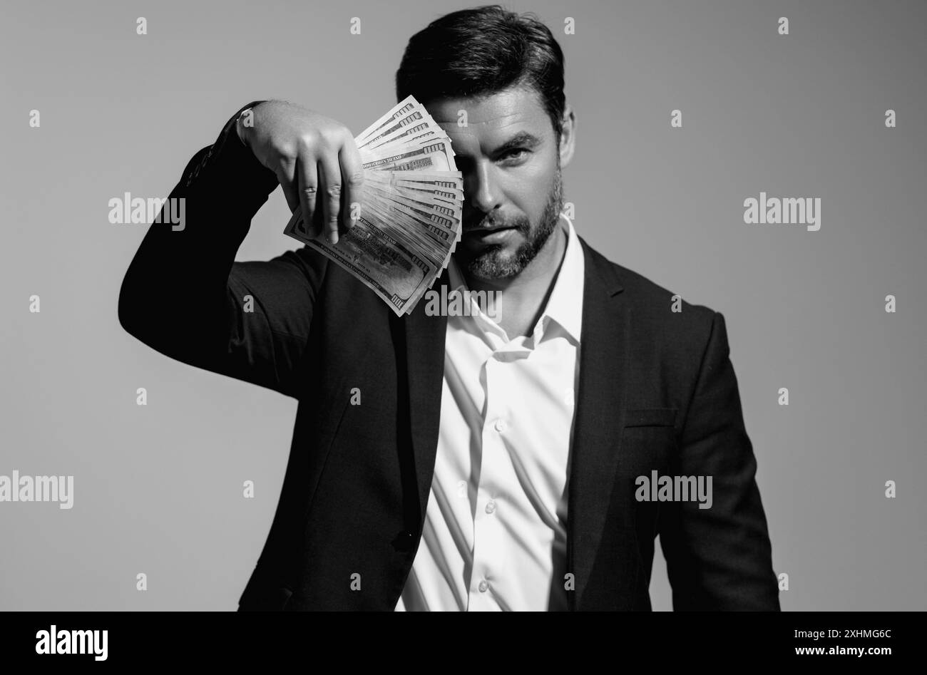 Man with dollars banknotes. Business man holding lots of 100 dollar ...