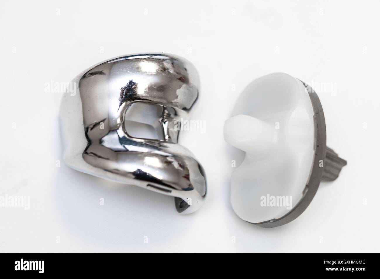 Close-up of various orthopedic knee replacement implants, showcasing ...