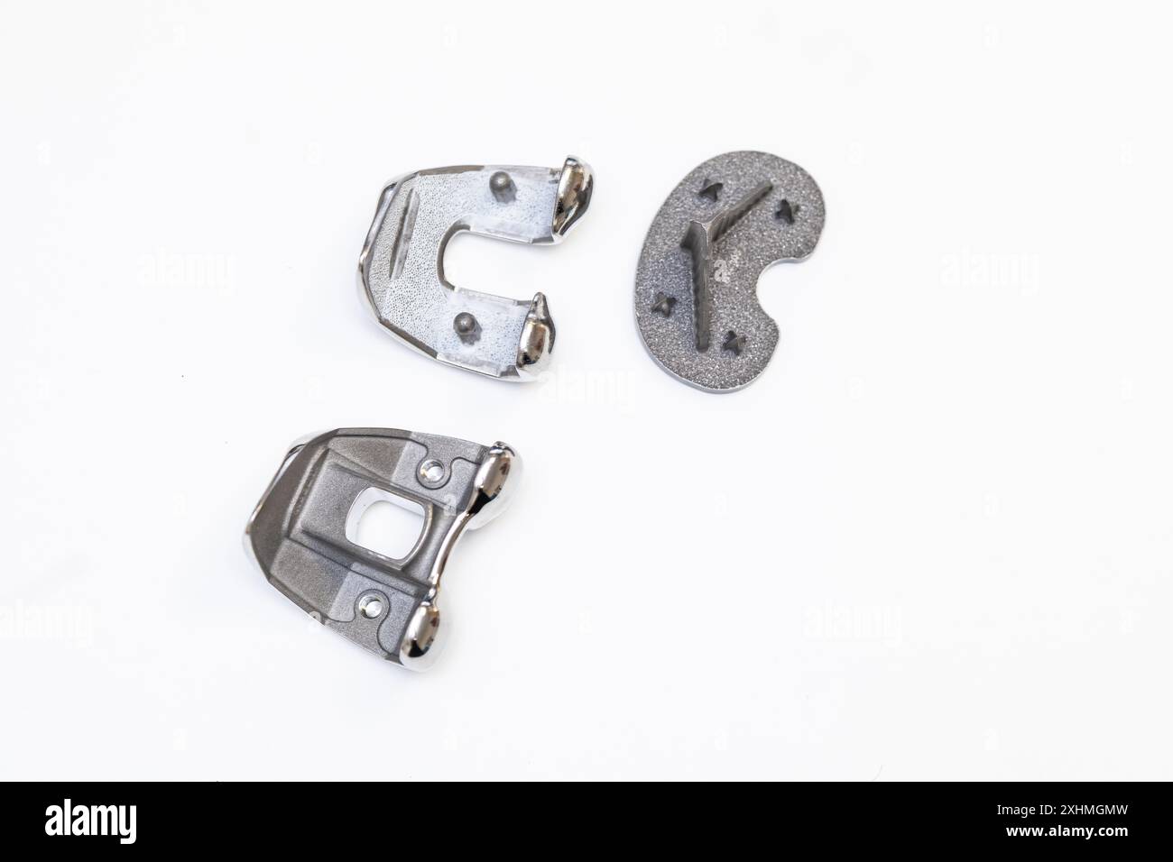 Close-up of various orthopedic knee replacement implants, showcasing ...