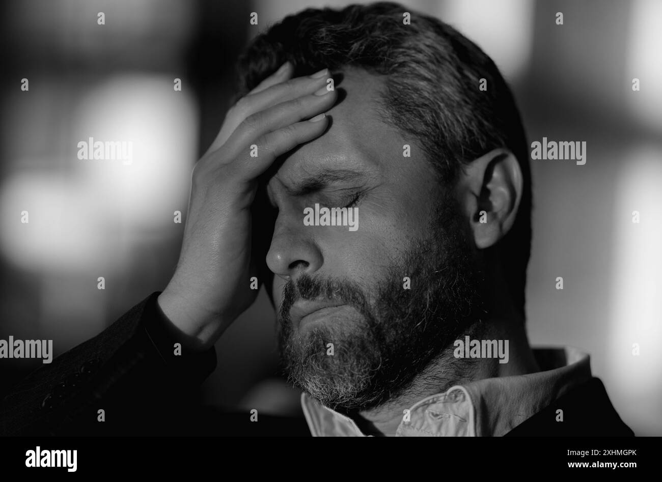 Stressed business man having headache at home office. Tired businessman ...