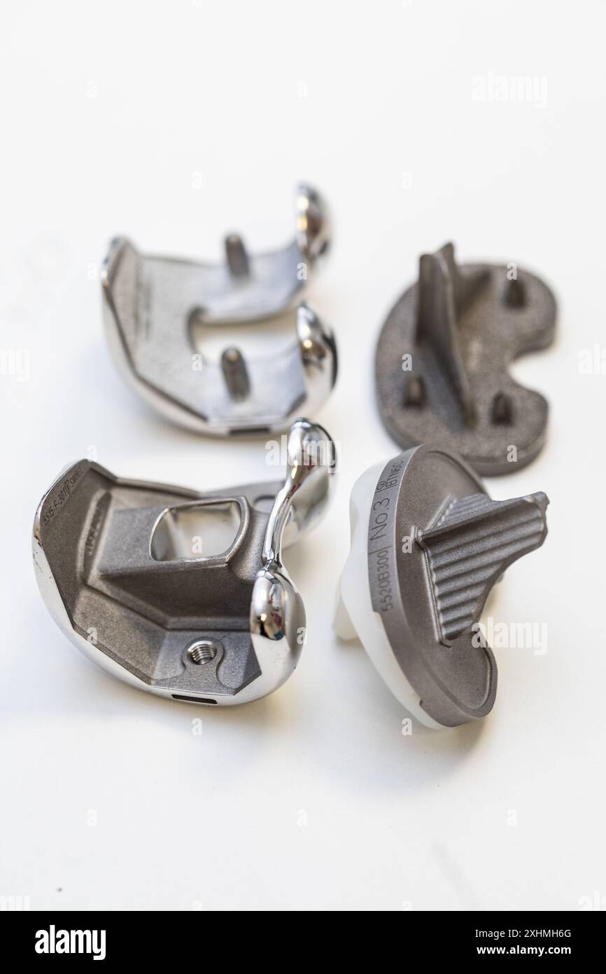Close-up of various orthopedic knee replacement implants, showcasing ...