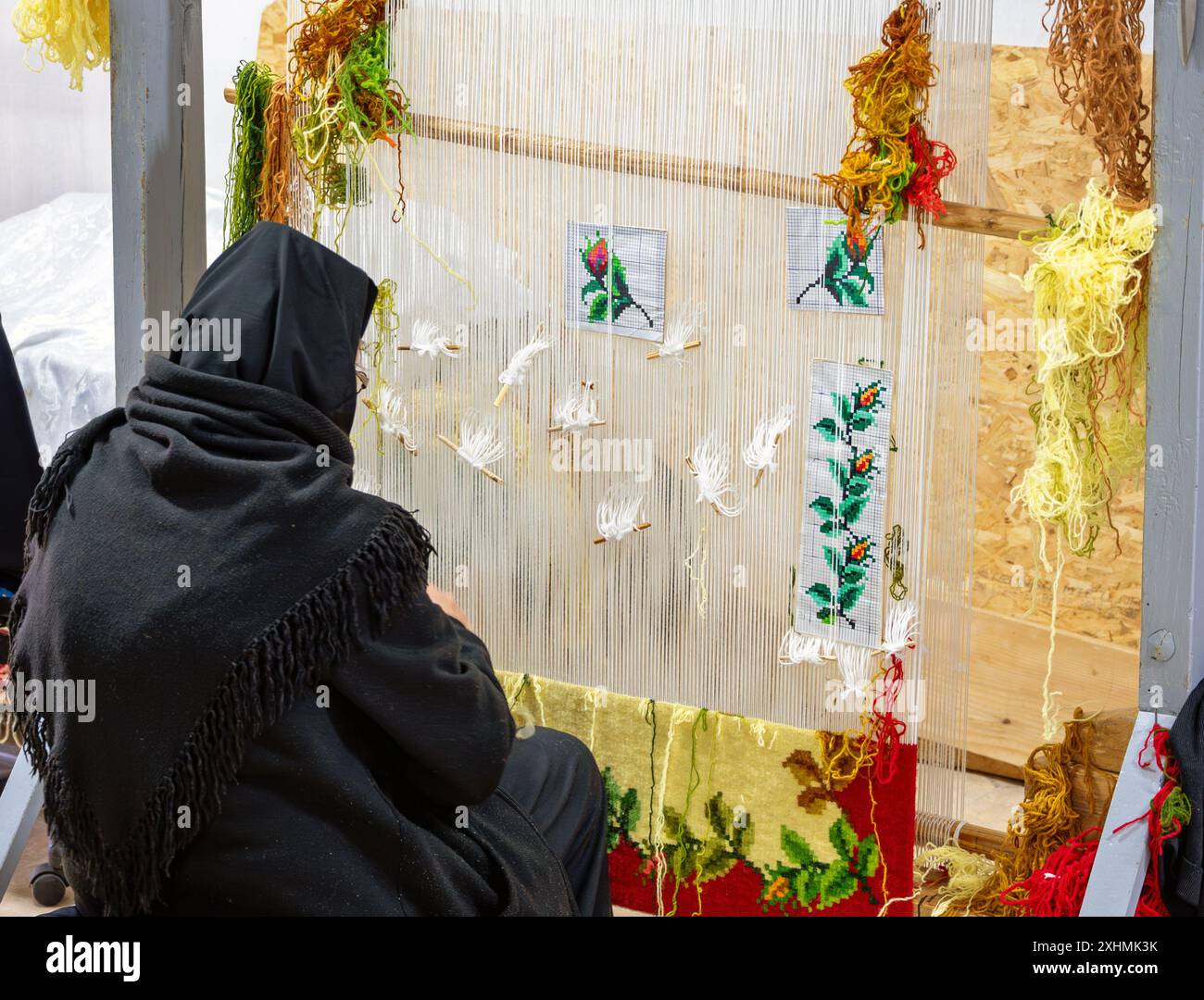 nun weaving carpet on a loom at the nunnery of Agapia in Romania Stock ...