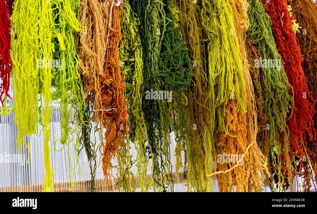 coloured wool strings on a loom at the romanian-orthodox nunnery of ...