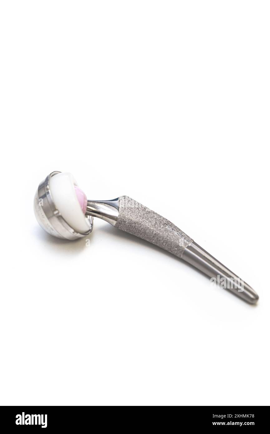 Close-up of a metal hip joint prosthesis on a white background ...