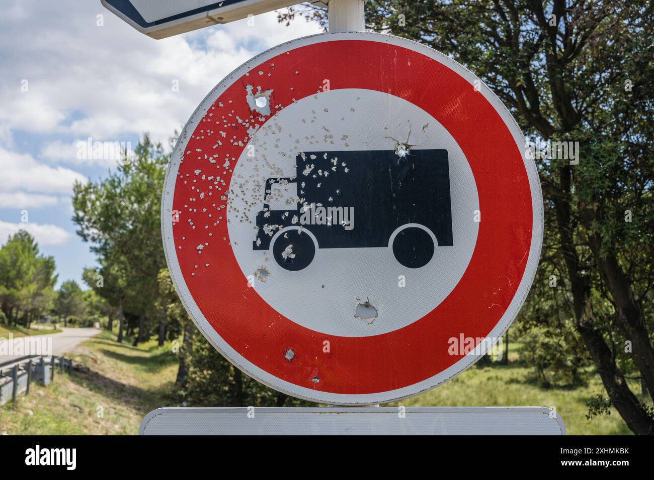 Damaged road sign in France, locals using the sign for target practice ...