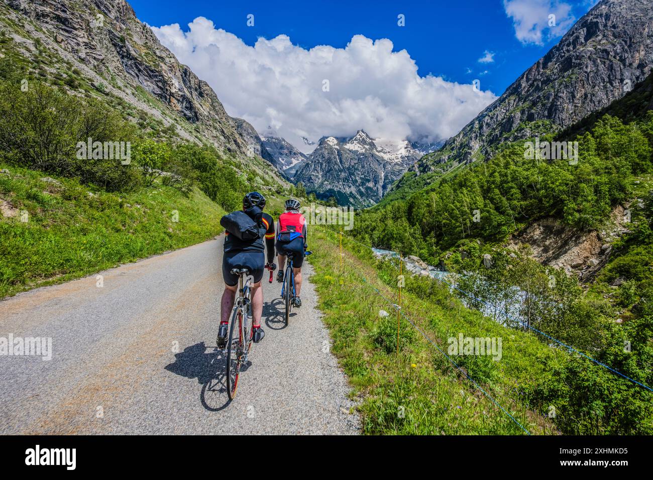 Mother and son cycling the famous route to Saint-Christophe-en-Oisans ...