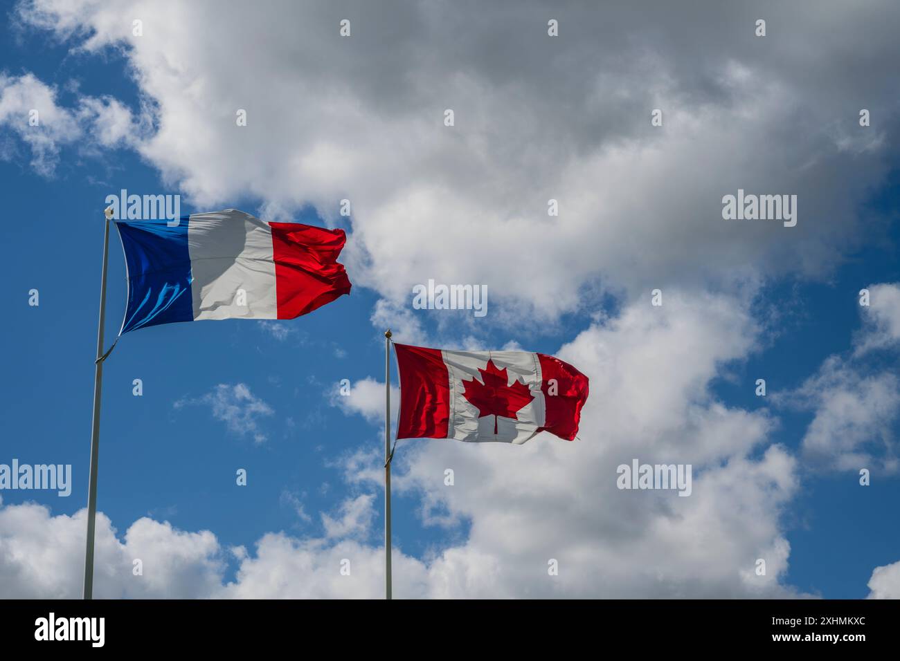 French and Canadian flags flutter in the wind at the Vimy Ridge ...