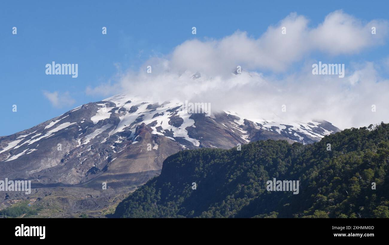 Active volcano with clouds on the mountain, southern Chile Stock Photo ...