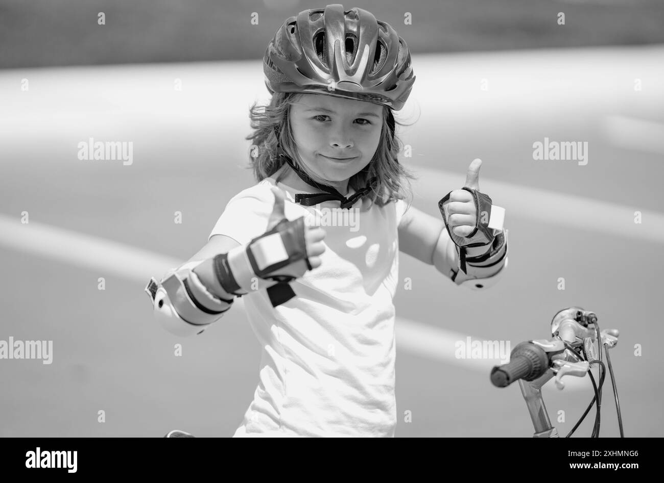 Kid ride bike. Child riding bicycle. Little kid boy in helmet on ...