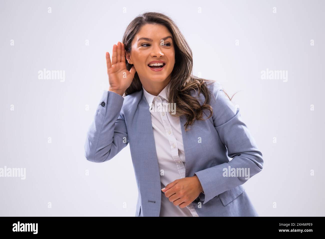 Portrait of happy businesswoman who is eavesdropping Stock Photo - Alamy
