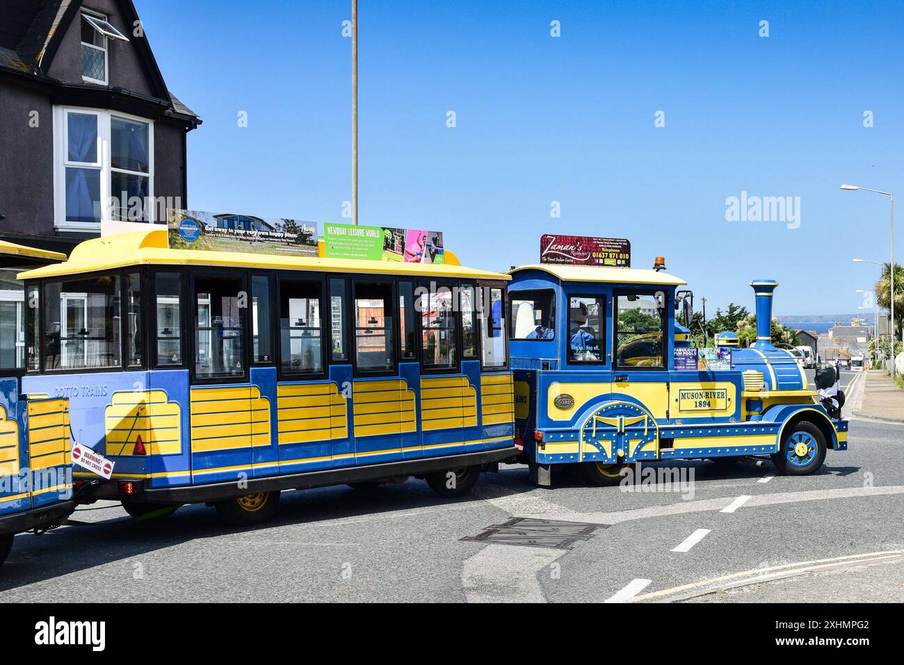 The colourful Newquay Road Train travelling through Newquay Town centre ...