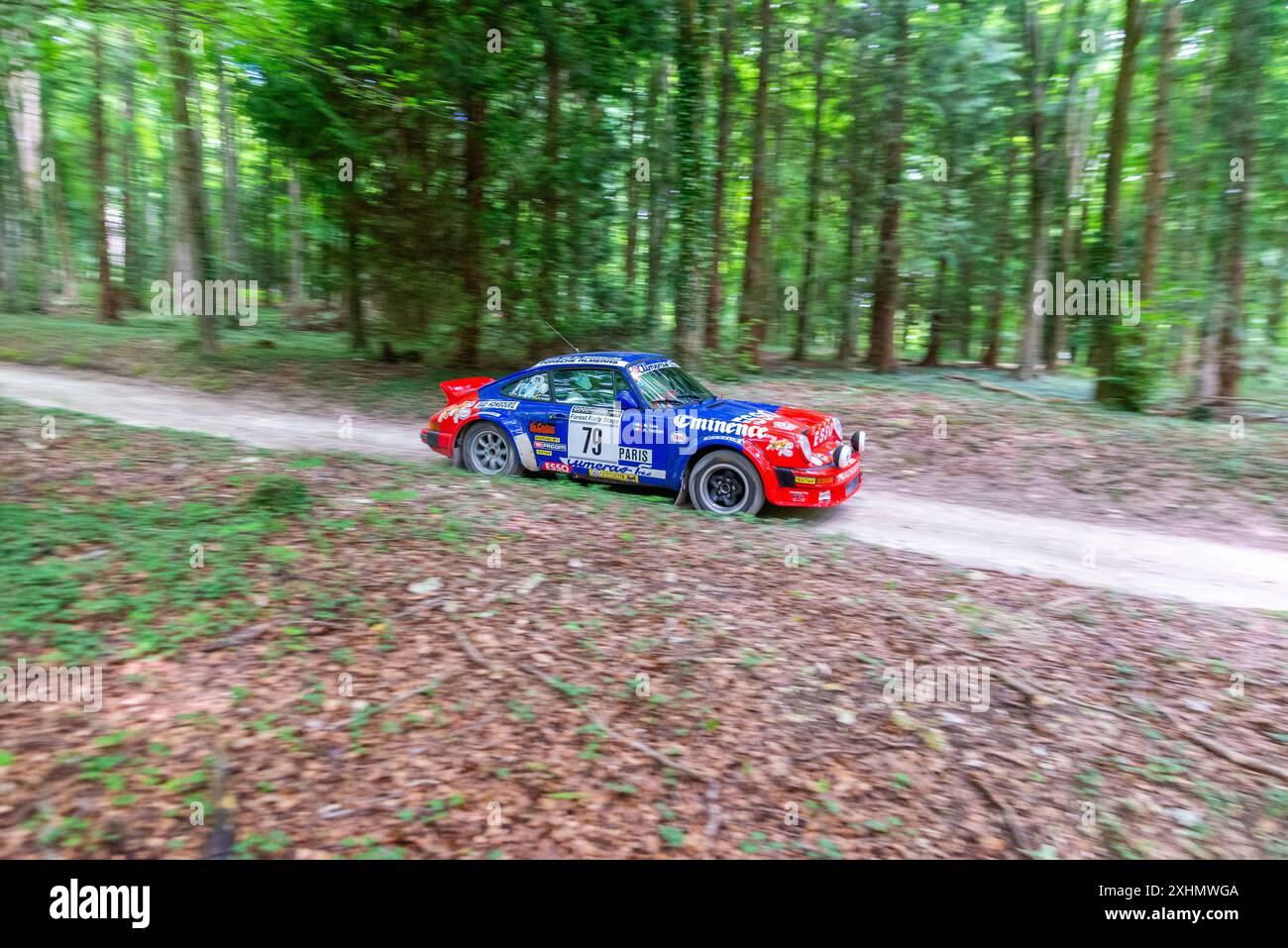 1982 classic Porsche 911 SC rally car on the rally stage through forest ...