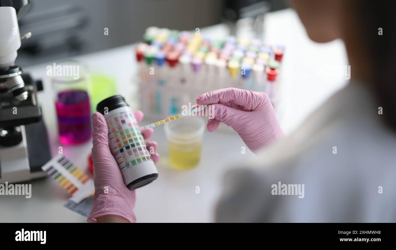 Laboratory assistant making medical test using testing strip Stock ...