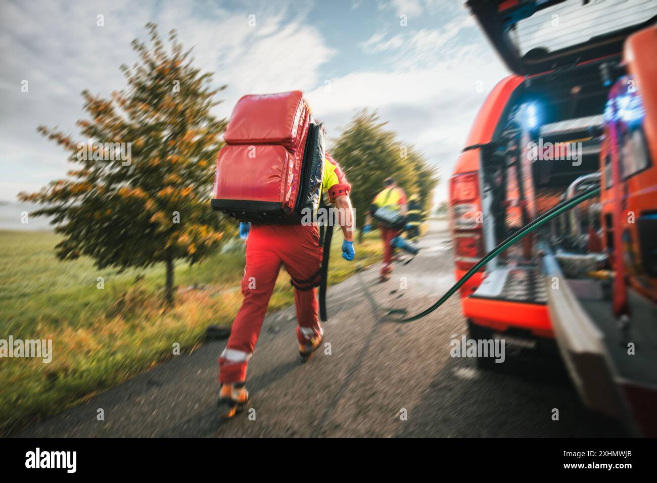 Paramedic and doctor of emergency medical medical service in blurred ...