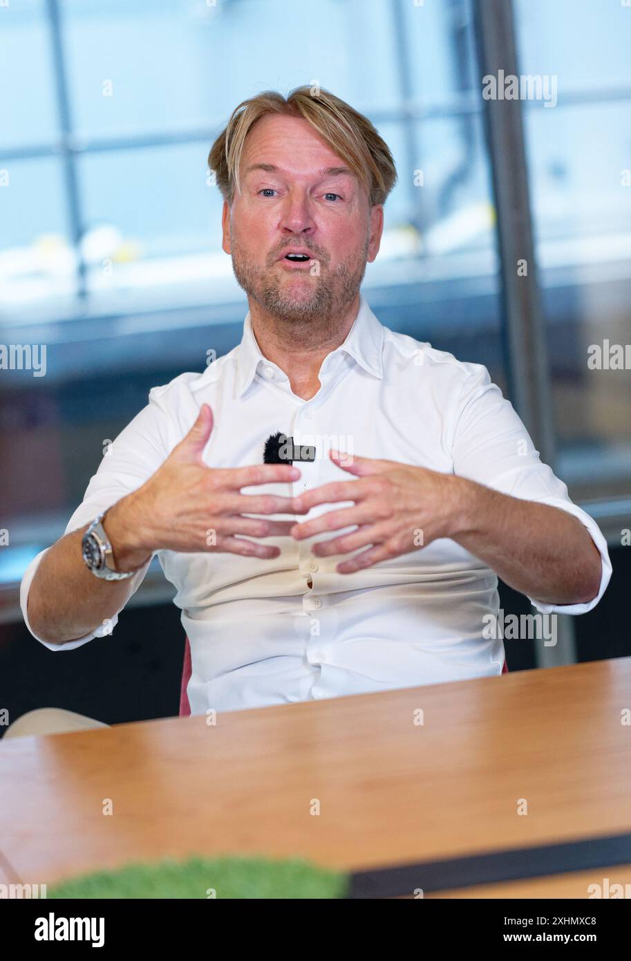 Cologne, Germany. 15th July, 2024. Music manager Wolfgang Krampe sits ...