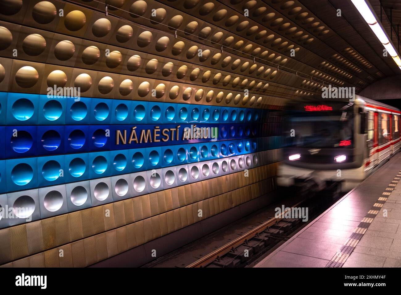 Train arives at Namesti Miru metro station, decorated with modern ...