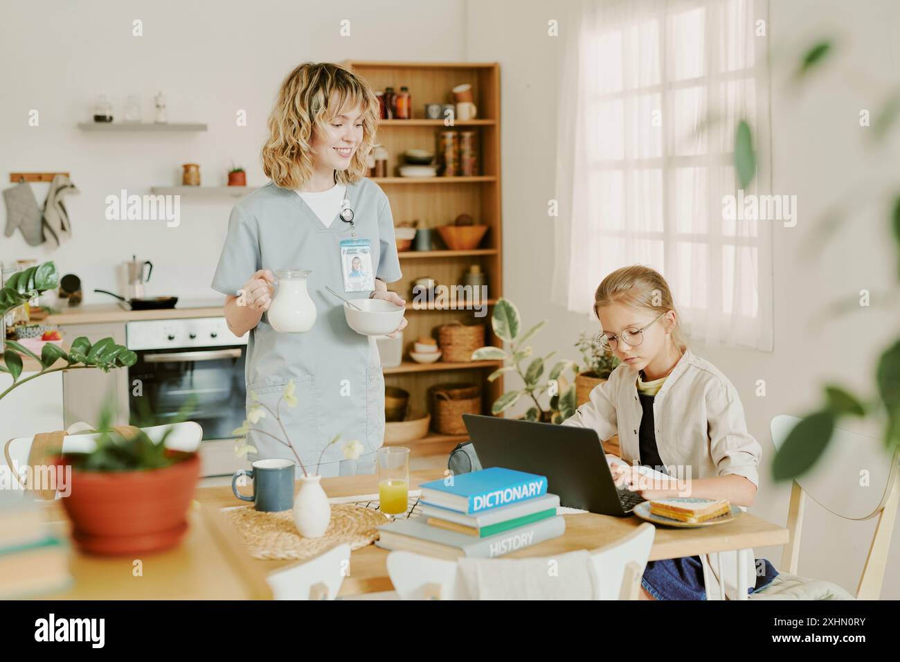 Parent looking at phone for help hi-res stock photography and images ...