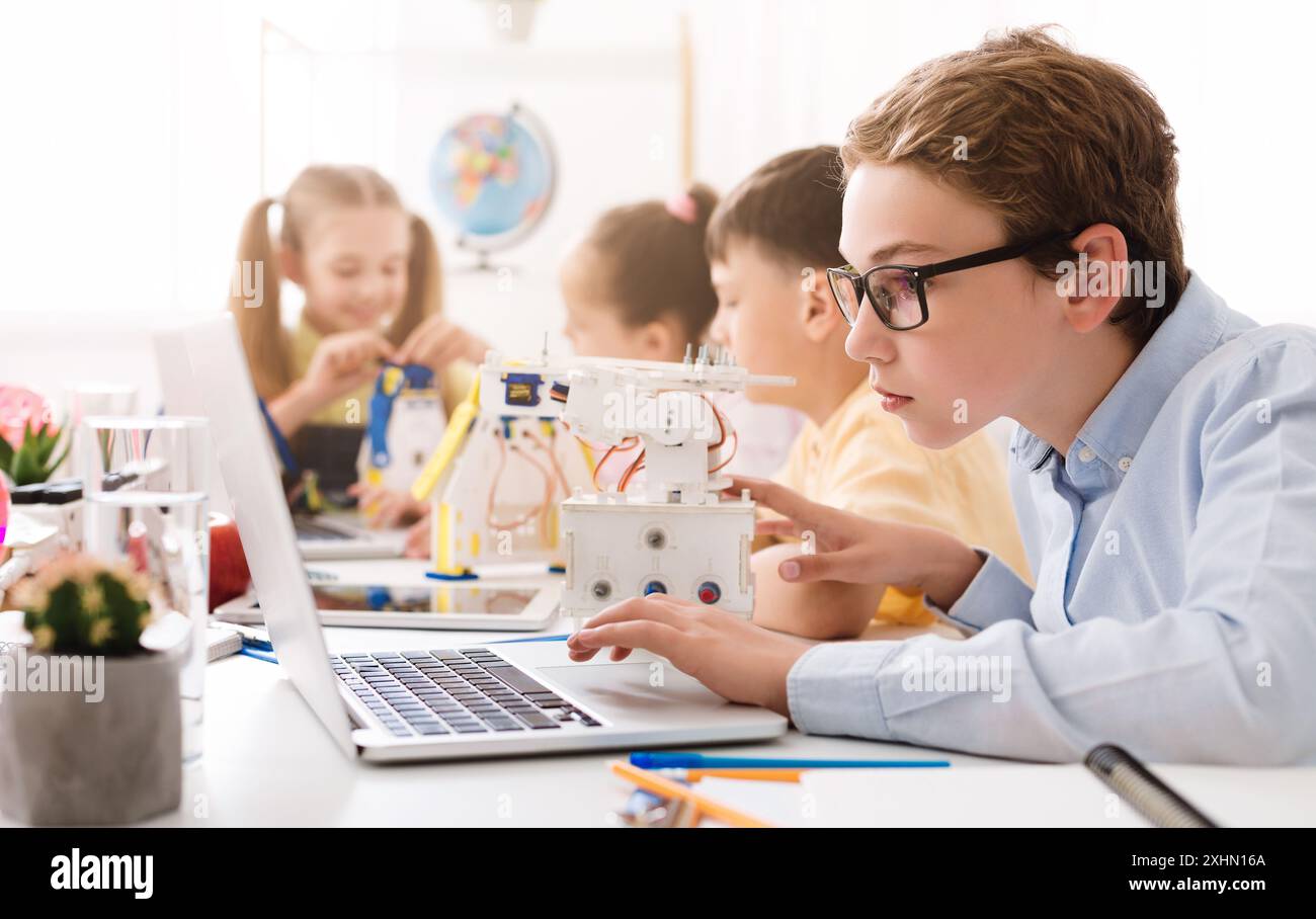 Teenage Boy Uses Laptop During Robotics Class Stock Photo - Alamy