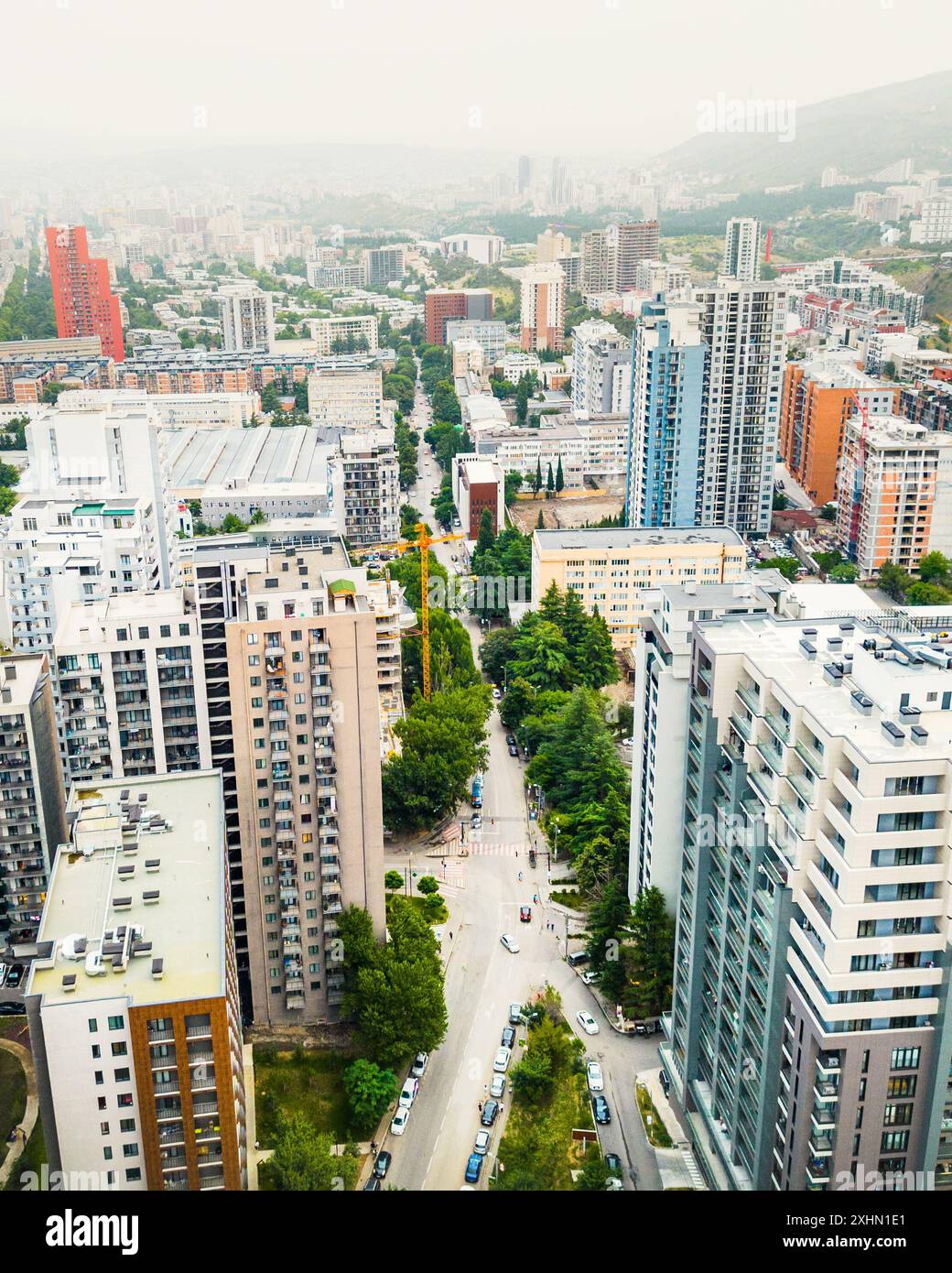 Aerial fly over new modern real estate block house buildings rooftops ...
