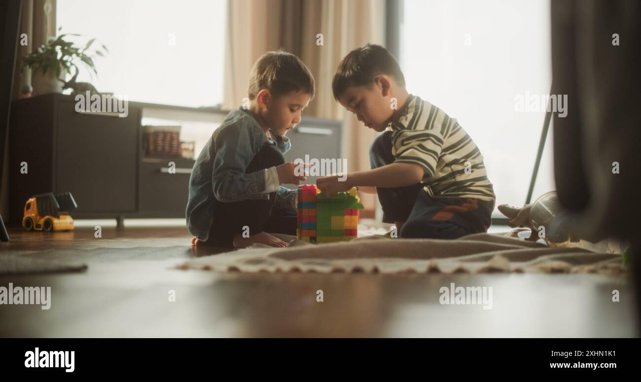 Portrait of Two Male Asian Kids Playing with Colorful Building Blocks ...
