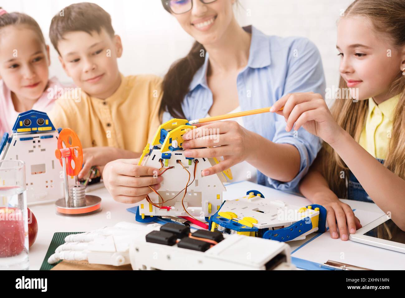 Group kids studying robotic parts hi-res stock photography and images ...