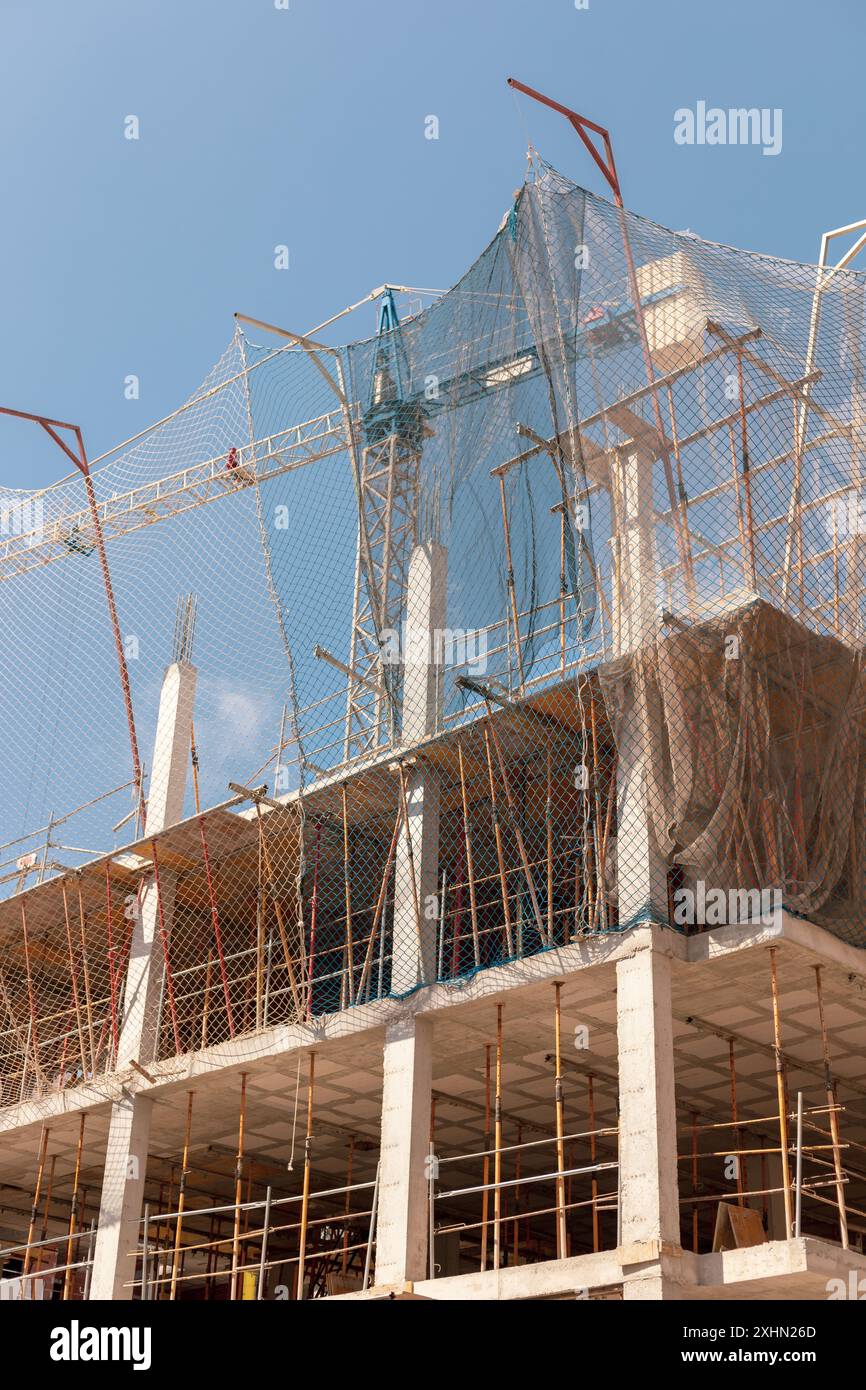 New building construction process. Safety nets and structural beams ...