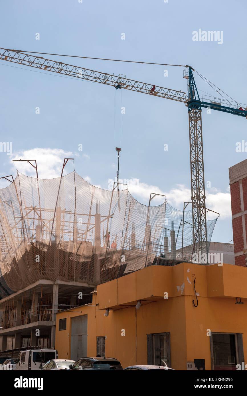 New building construction process. Safety nets and structural beams ...
