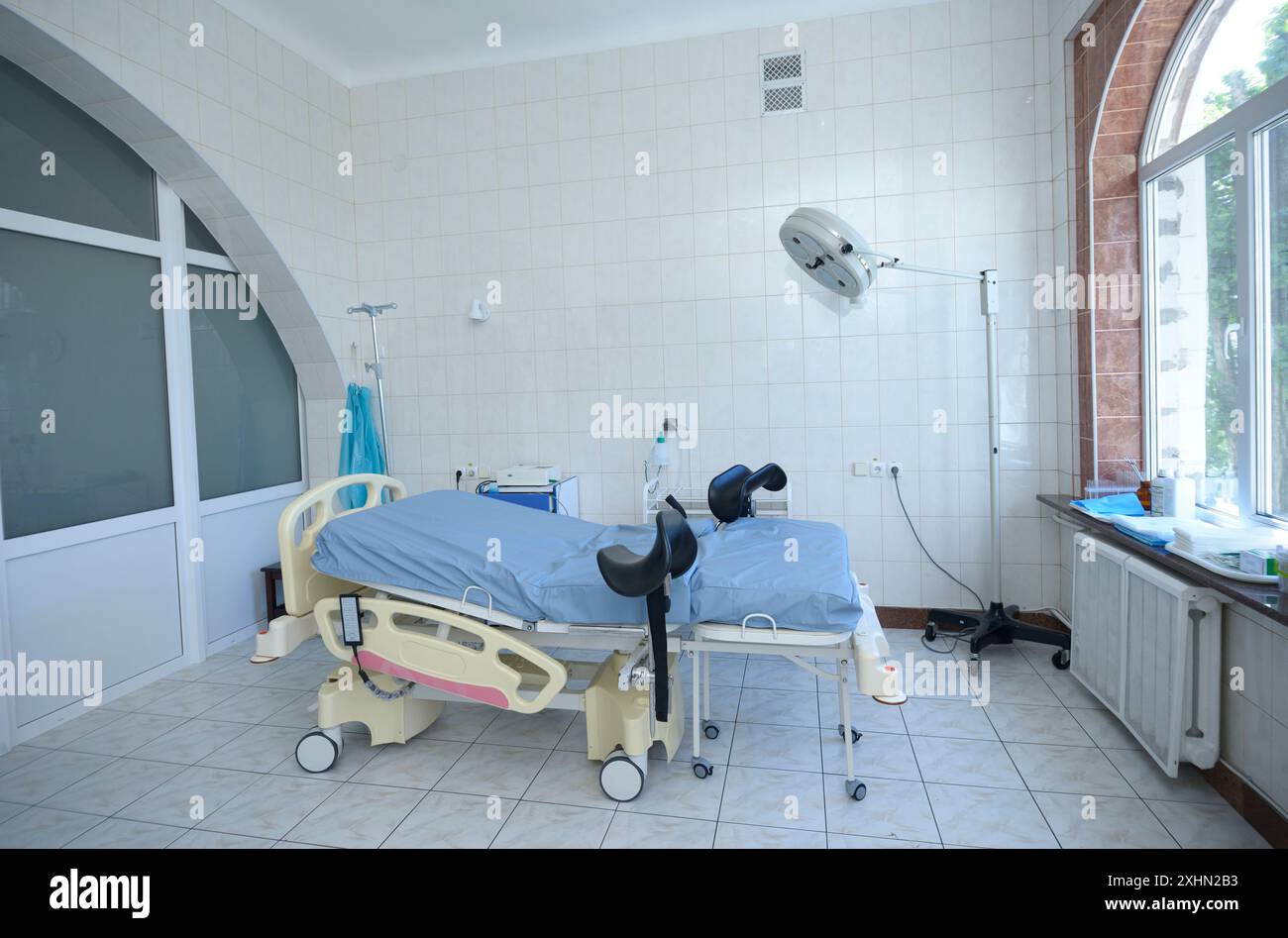 Delivery room of a maternity hospital, obstetric bed, medical equipment ...