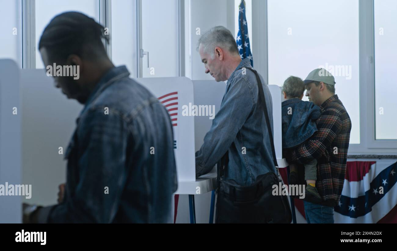 Diverse American citizens come to vote in booth in polling station ...