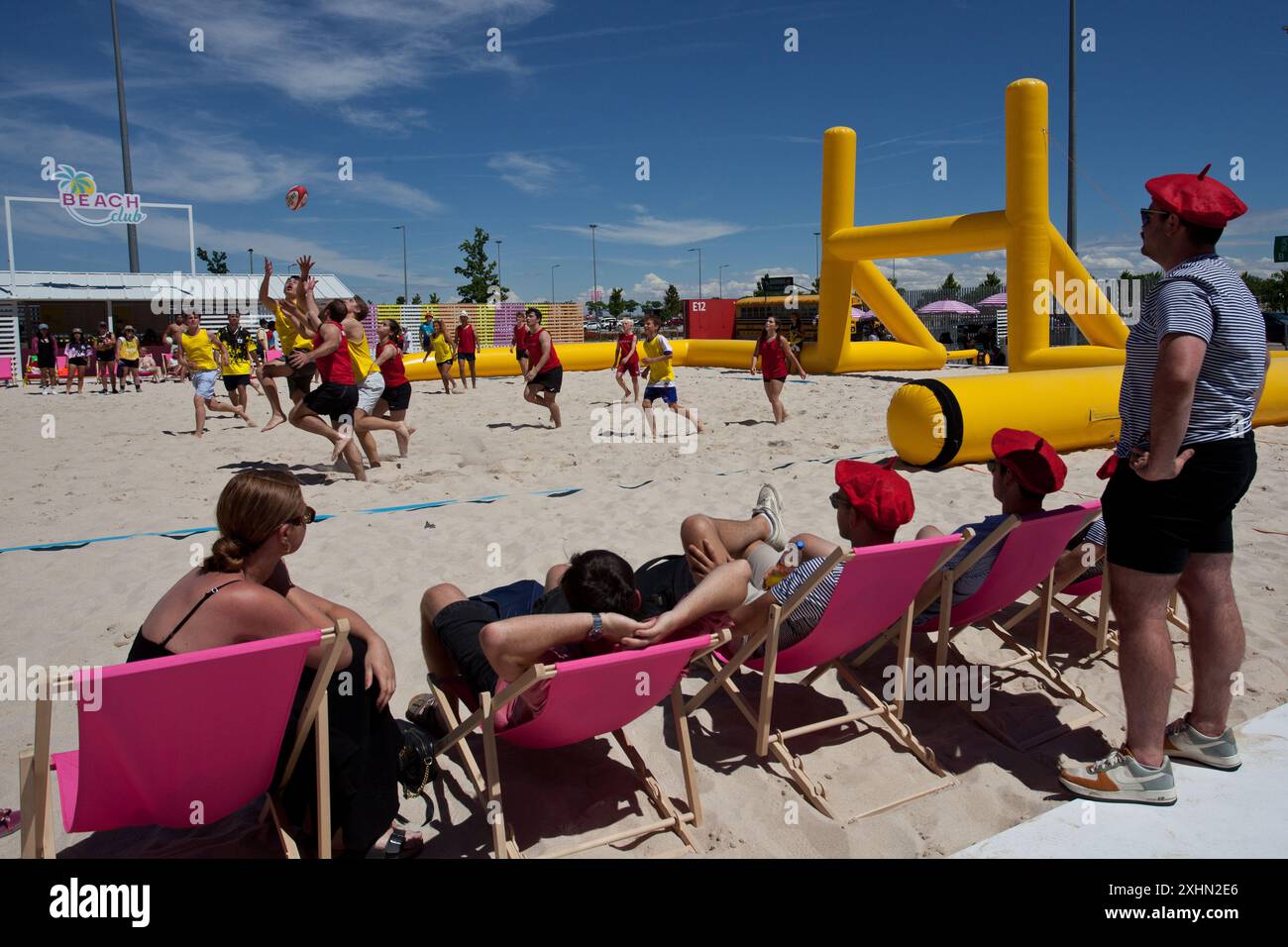 People playing beach rugby at the fan zone of the Metropolitano stadium ...