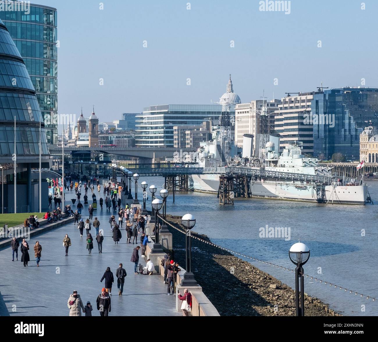 Southbank with view of the river Thames and HMS Belfast, London ...