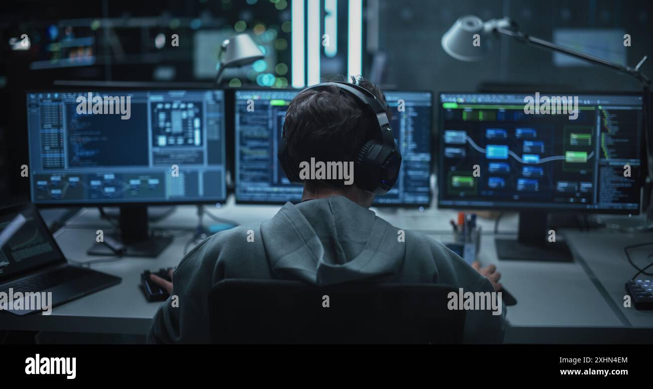 Developer using multiple displays coding hi-res stock photography and images - Alamy