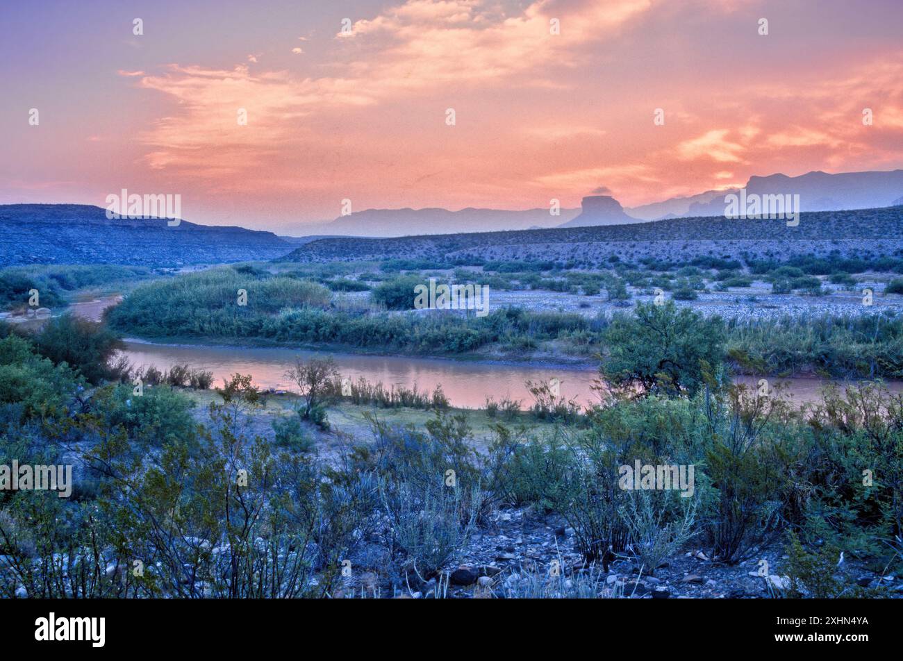 Rio Grande at sunrise, Cerro el Barco butte in Mexico, canoeists camp ...