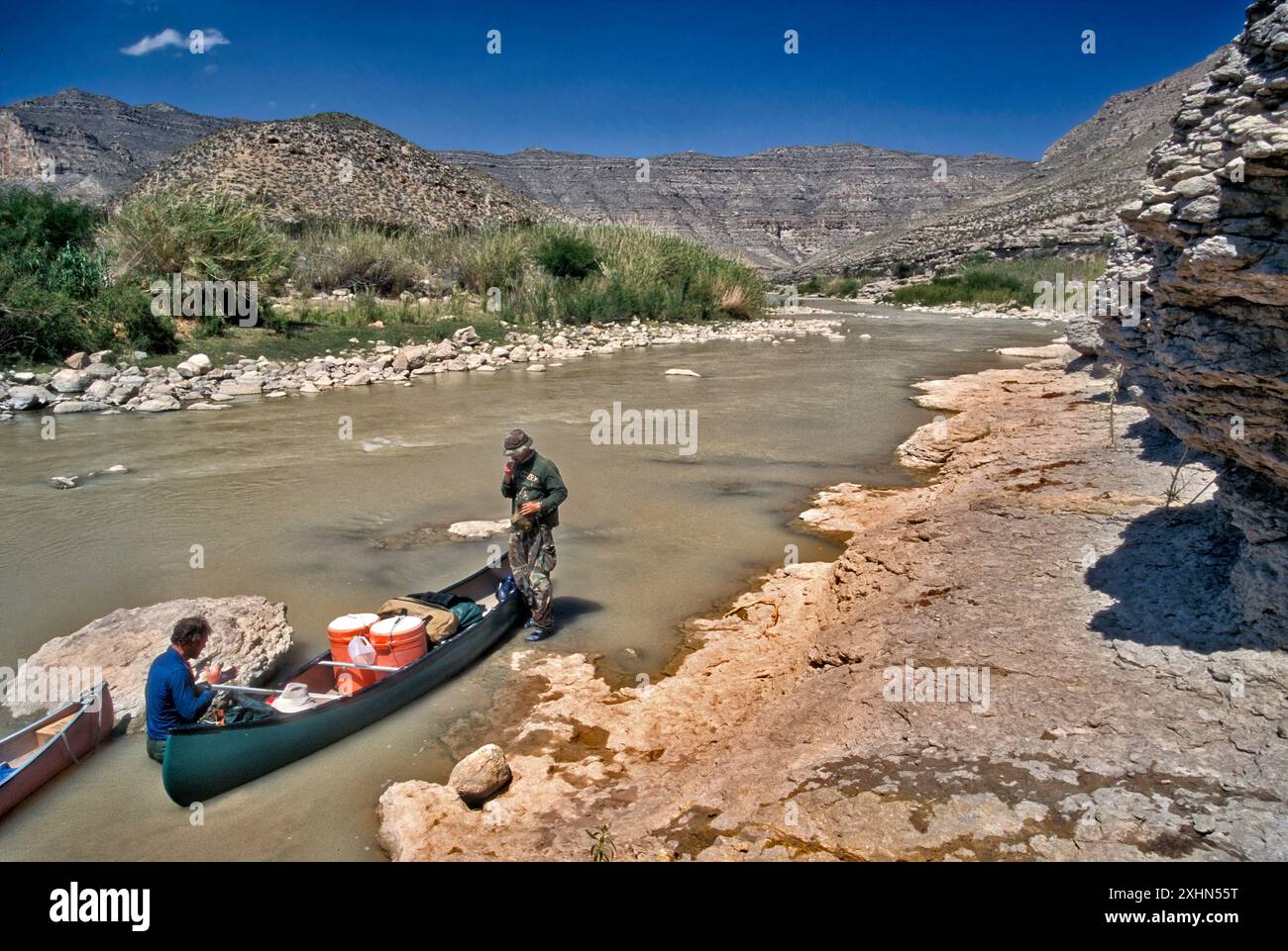 Canoeists at Rio Grande river-bank, The Lower Canyons of Rio Grande ...