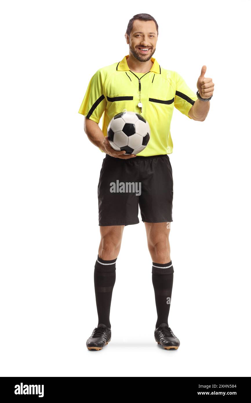 Football referee holding a ball and gesturing thumbs up isolated on ...