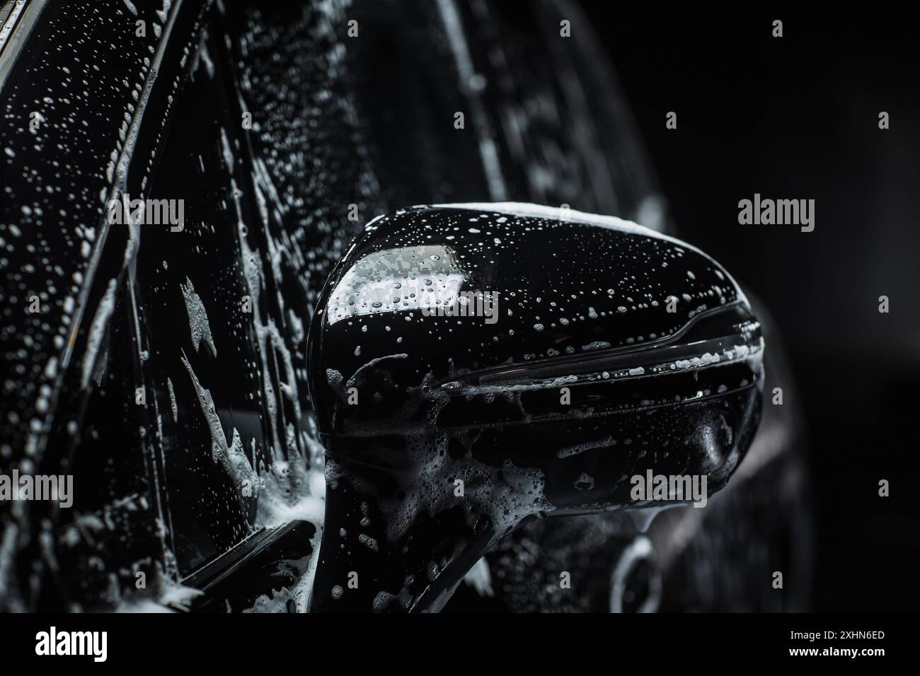 Commercial Photo of a Black Electric SUV Covered in Washing Soap and ...
