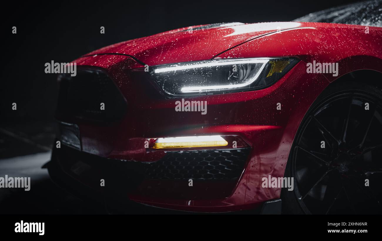 Close Up of a Modern Red Performance Car in a Dark Studio Environment ...